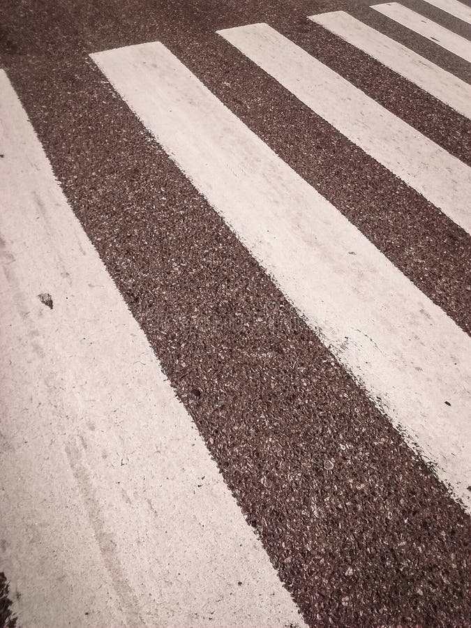 Zebra Crossing Over a Rough Street Stock Photo - Image of crossing ...