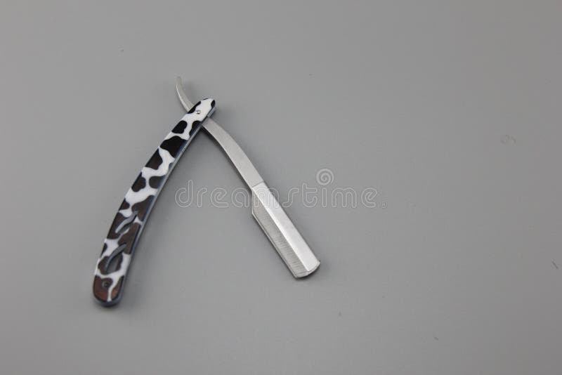 Zebra Handle Blade Placed on a Gray Background Stock Image - Image of ...