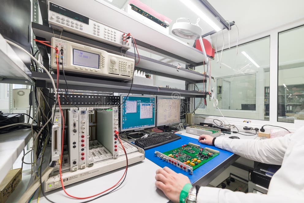 The Engineer Conducts a Test of the Finished Electronic Modules ...