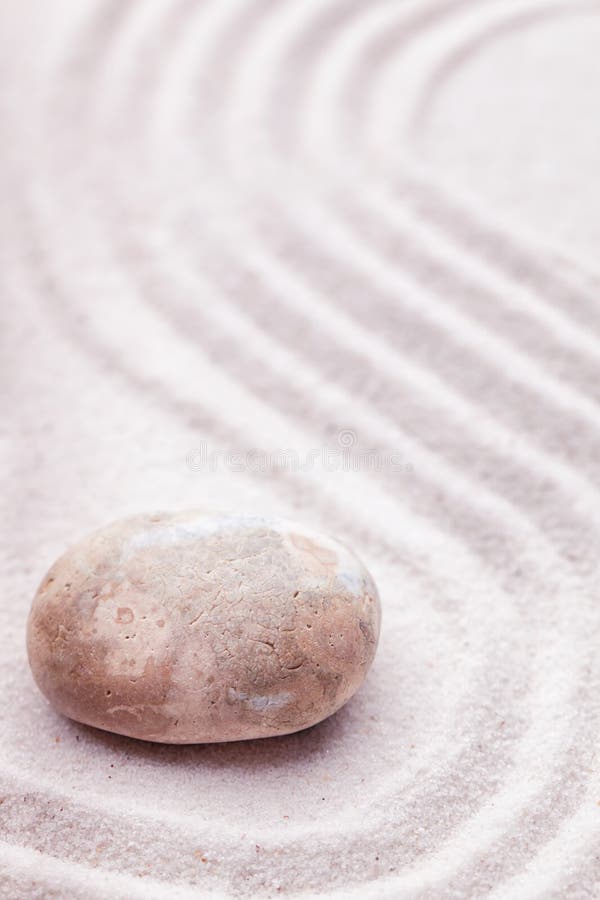 A Zen Garden with a Marble Rock and Wave Pattern in the Sand Stock ...