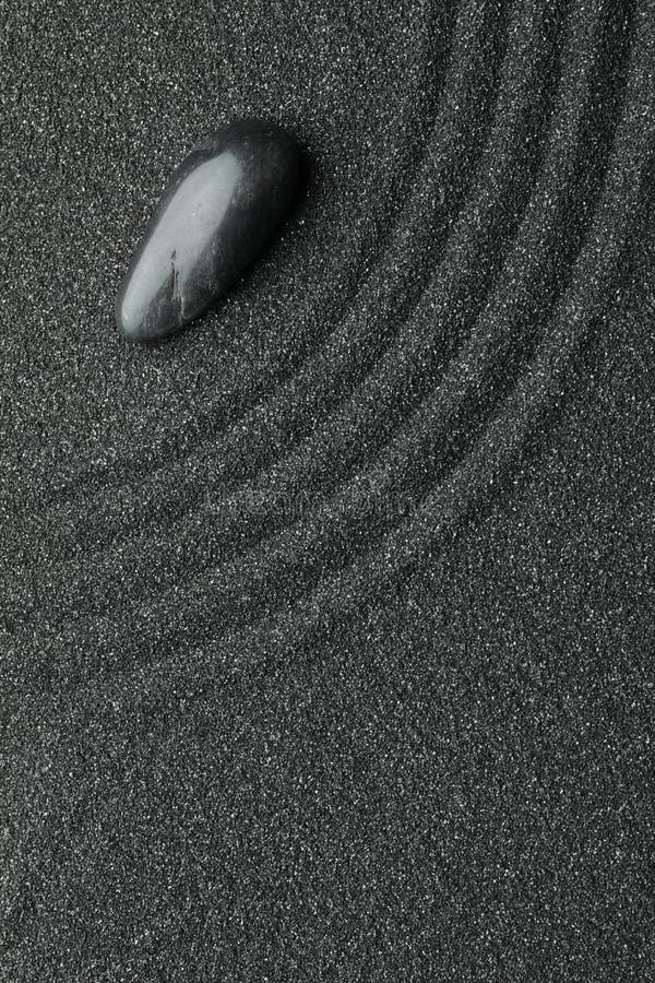 Zen Garden Stone on Black Sand with Pattern, Top View Stock Photo ...