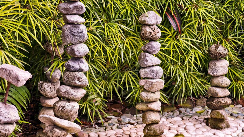 Balanced Stone Cairns in a Zen Garden Stock Image - Image of ...