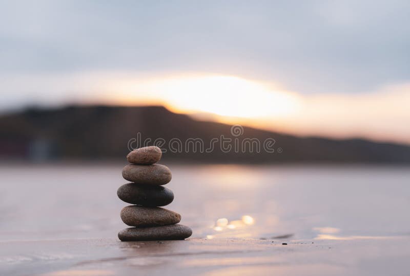 Zen Stack Stone on Sea Sand Beach with Blurry Sunset Background,Image ...