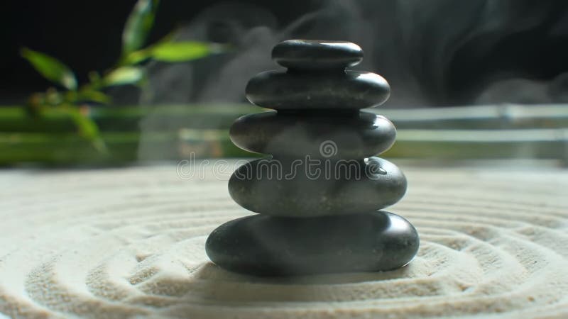 Zen Stone Stack on Sand with Bamboo, Conveying Tranquility. Stock ...