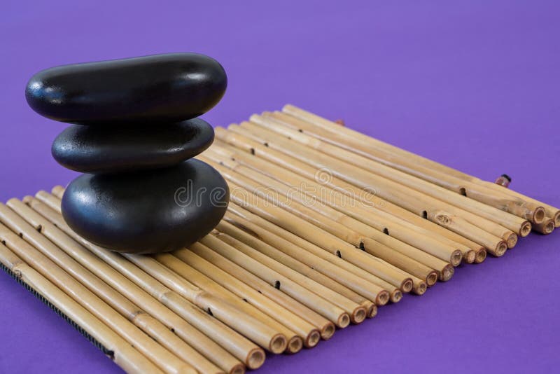 Zen stones on bamboo mat stock image. Image of black - 87876529