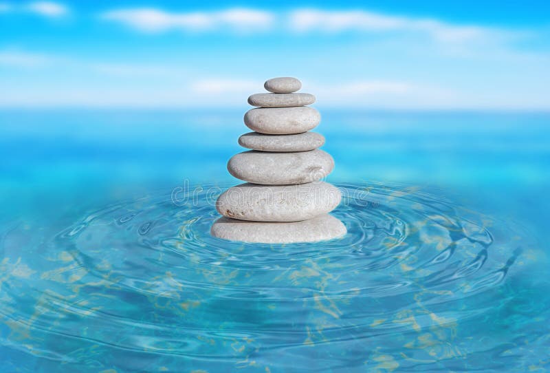 Zen Stones Stack from Large To Small in Water with Circular Wave Stock ...
