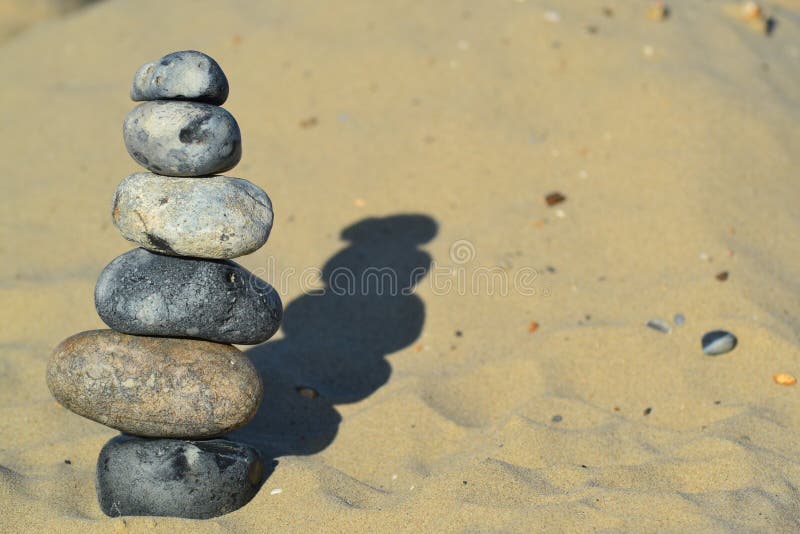 Zen stones stacked on sand stock image. Image of stone - 75510787