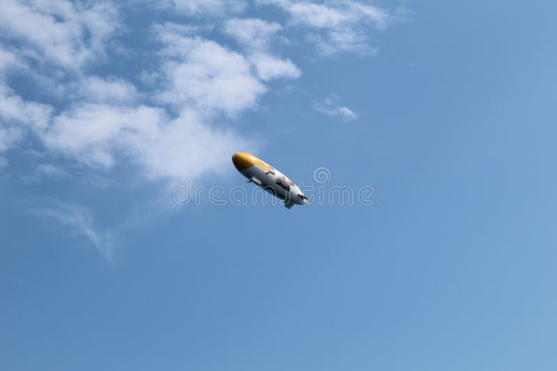 Zeppelin Flying in the Blue Sky. Zeppllin Airships Often Offer Tourist ...