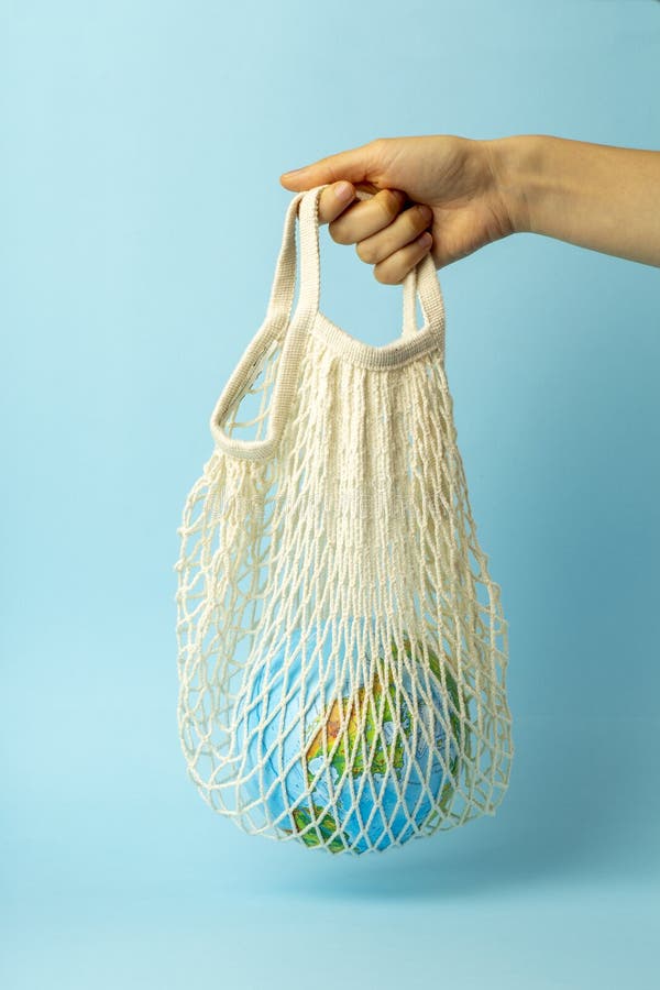 Zero Waste Concept. String Bag and Plastic Bag in a Female Hand with ...