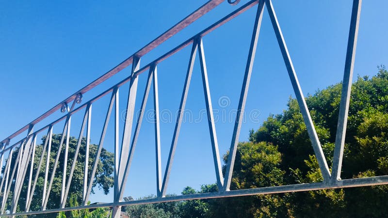 Iron Railings on the Balcony, Green Trees and Blue Sky Background Stock ...