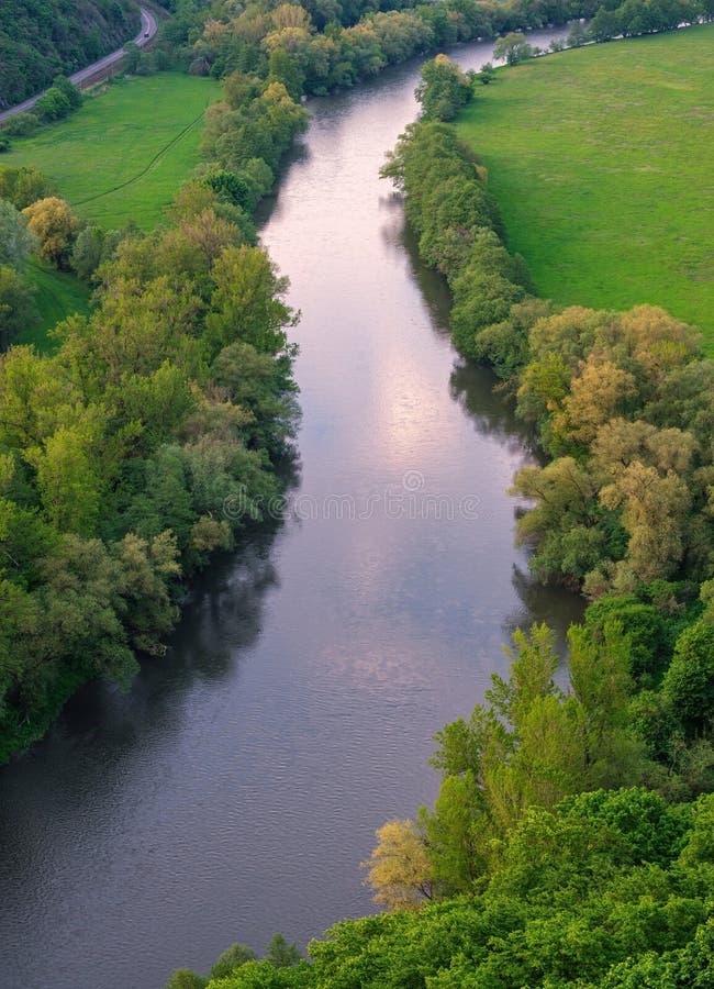 Zigzag River Flows between Summer Valleys.Sunset River Water Natural ...