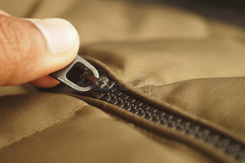 Zipper Being Pulled on a Brown Jacket in a Cozy Setting Stock Photo ...