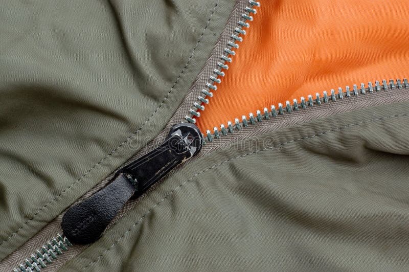 Zipper of a green jacket stock photo. Image of unzipped - 23623564