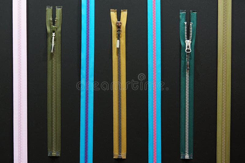 Zippers for Clothes on Black Stock Photo - Image of color, closeup ...