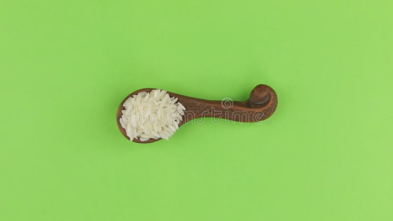 Zoom of a Clay Spoon with Rice Grain. Chroma Key, Green Screen Stock ...