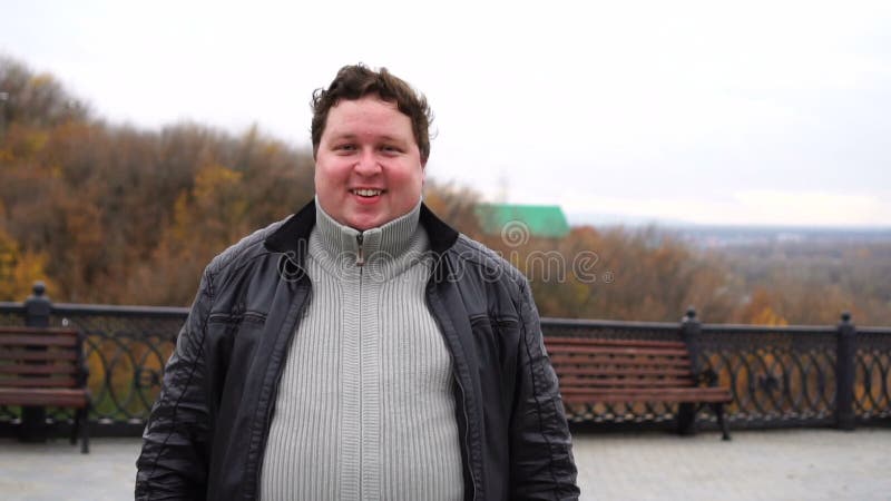 Zoom in from Close Up, Portrait of Happy Fat Man Looking Directly at ...