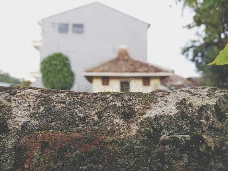 Zoom in on the Crumbly Wall and See a Small Building. Stock Image ...