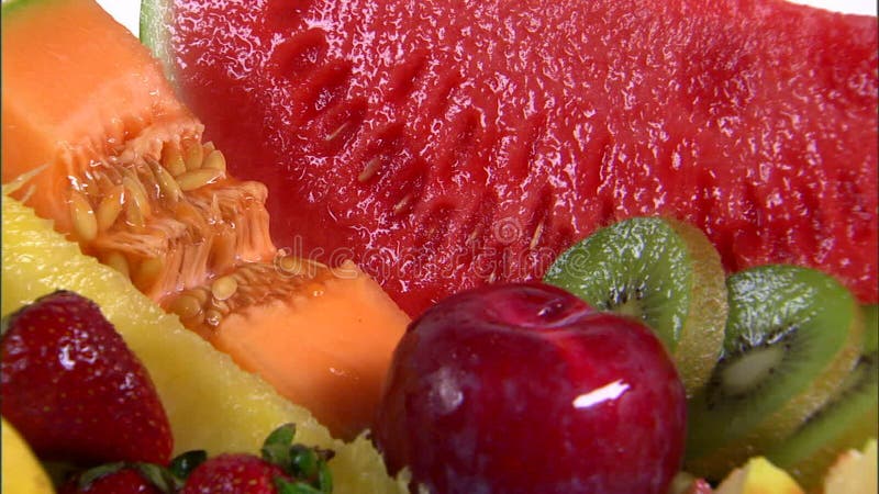 Zoom Out of Assorted Fruit Rotating on White Background Stock Video ...