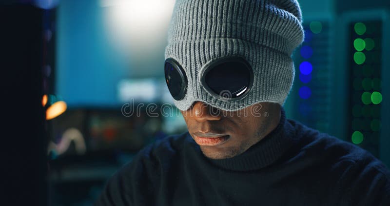Black Hacker in Mask Using Computer Stock Photo - Image of browsing ...