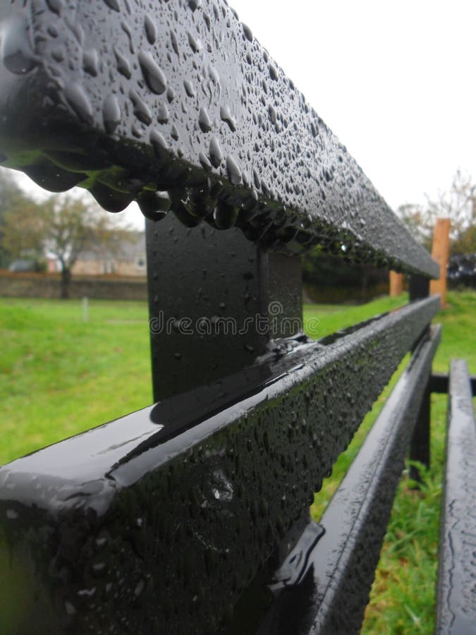 Zoomed in View of a Black Park Bench with Rain Drops Stock Image ...