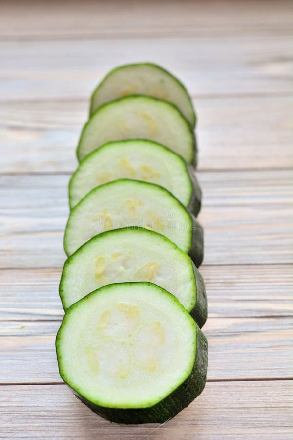 Zucchini Cut into Slices on a Table Stock Image - Image of kitchen ...