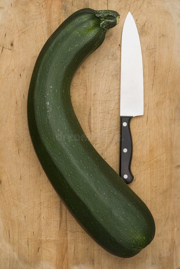Zucchini and Knife on Cutting Board Stock Photo - Image of green ...
