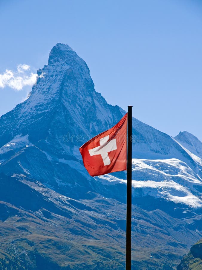 Zwitserse Vlag Met De Matterhorn Stock Foto - Image of blauw, kruis ...