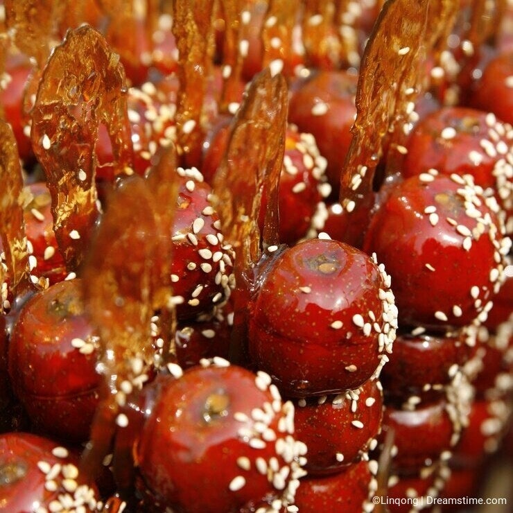 Candied haws on a stick. - Dreamstime