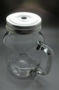 Image of Empty smiling skull glass mug with lid and straw ...
