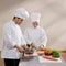 Chefs in Toques Preparing and Chopping Food Stock Image - Image of ...