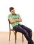 Handsome Young Man Sitting Slumped in a Chair Stock Image - Image of ...