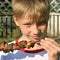 Muchacho Con La Carne Asada a La Parilla Imagen de archivo - Imagen de ...