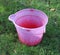 A Sun-Bleached Red Plastic Bucket Stock Photo - Image of worn, faded ...
