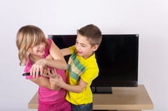 Siblings Fighting Over The Remote Control Stock Photo - Image: 88456785