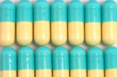 Blue Yellow Capsule On Blue Pills Lined Up Stock Photo - Image of food ...