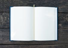 Open Book On A Dark Wood Table Stock Image - Image: 58788111