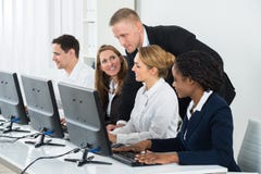 Manager Assisting His Staff In Office Stock Photo - Image of busy ...
