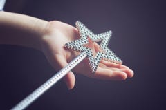 Hand holding a magic wand stock image. Image of artistic - 12227631
