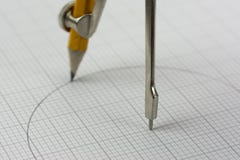 Compass Drawing Circle On Graph Paper Stock Photos - Image: 15694353