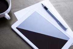 Tablet Pc And A Coffee And Notebook With Pen On The Office Desk Royalty ...