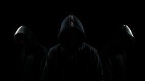 Five Mysterious Hooded Men Standing In The Dark With Hoodies And Hidden ...
