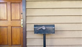 Mailbox In The Front Door Of A House Stock Photo - Image: 20990890