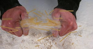 Hands Of Man Breaking Spaghetti Pasta Against Flour Background, Stock ...