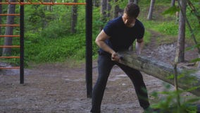Fit Strong Man Lifting A Log In A Forest Stock Footage - Video of ...