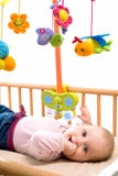 Baby on crib stock image. Image of cheerful, excitement - 4687117