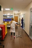 Patient Walking In Hospital Hallway Stock Image - Image of inside ...