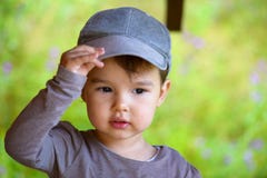 Child putting on hat stock photo. Image of child, protect - 35617796