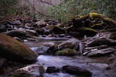Slow Shutter Speed Nature Photography Of A Waterfall With Moss Covered ...