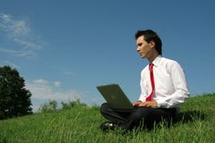 Businesswoman Using Computer In A Green Field Stock Image - Image of ...