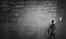 Man writing on blackboard stock photo. Image of knowledge - 74612704